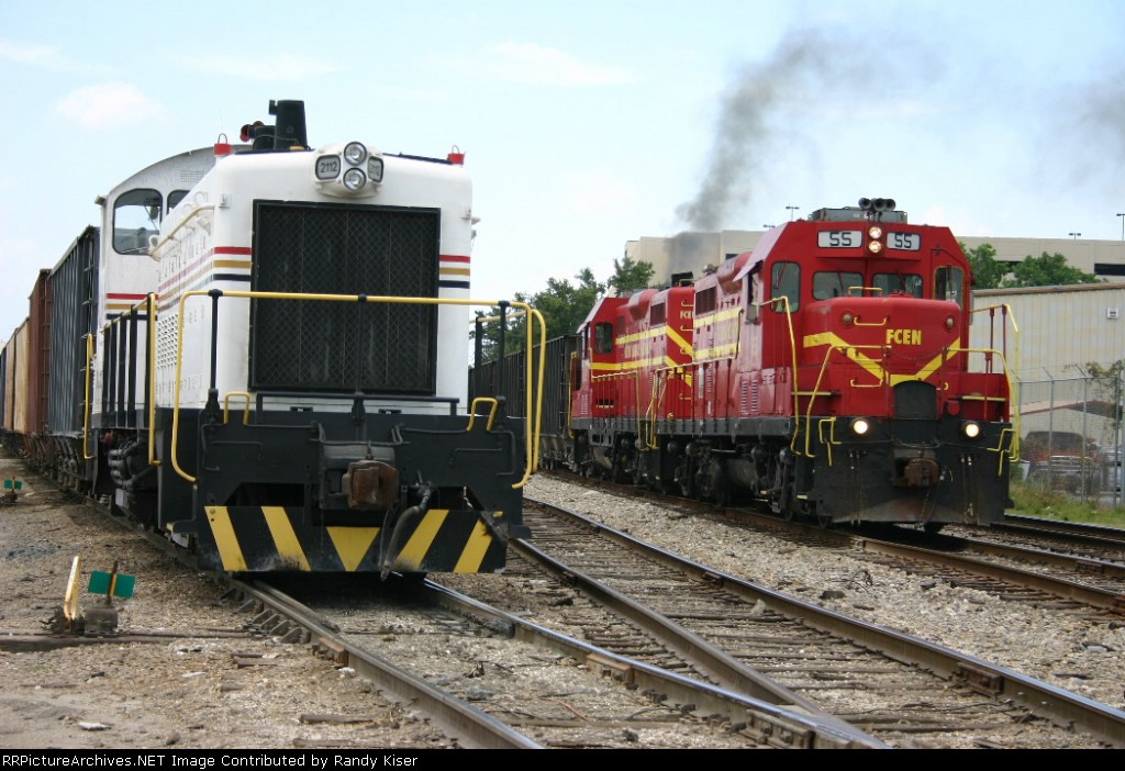 FCEN 55 and 57 pass thru Kaley yard as CYDX 1224 watches